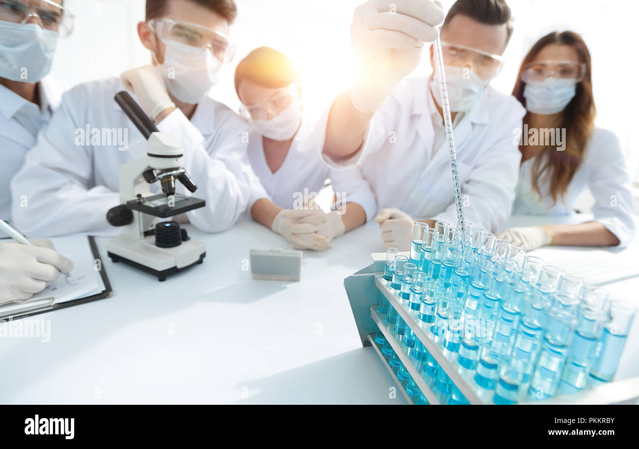 Scientists at chemical laboratory during work Stock Photo - Alamy