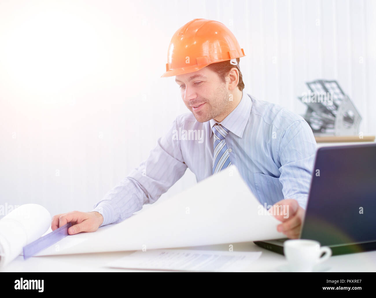 Architect looking working in office at desk Stock Photo - Alamy