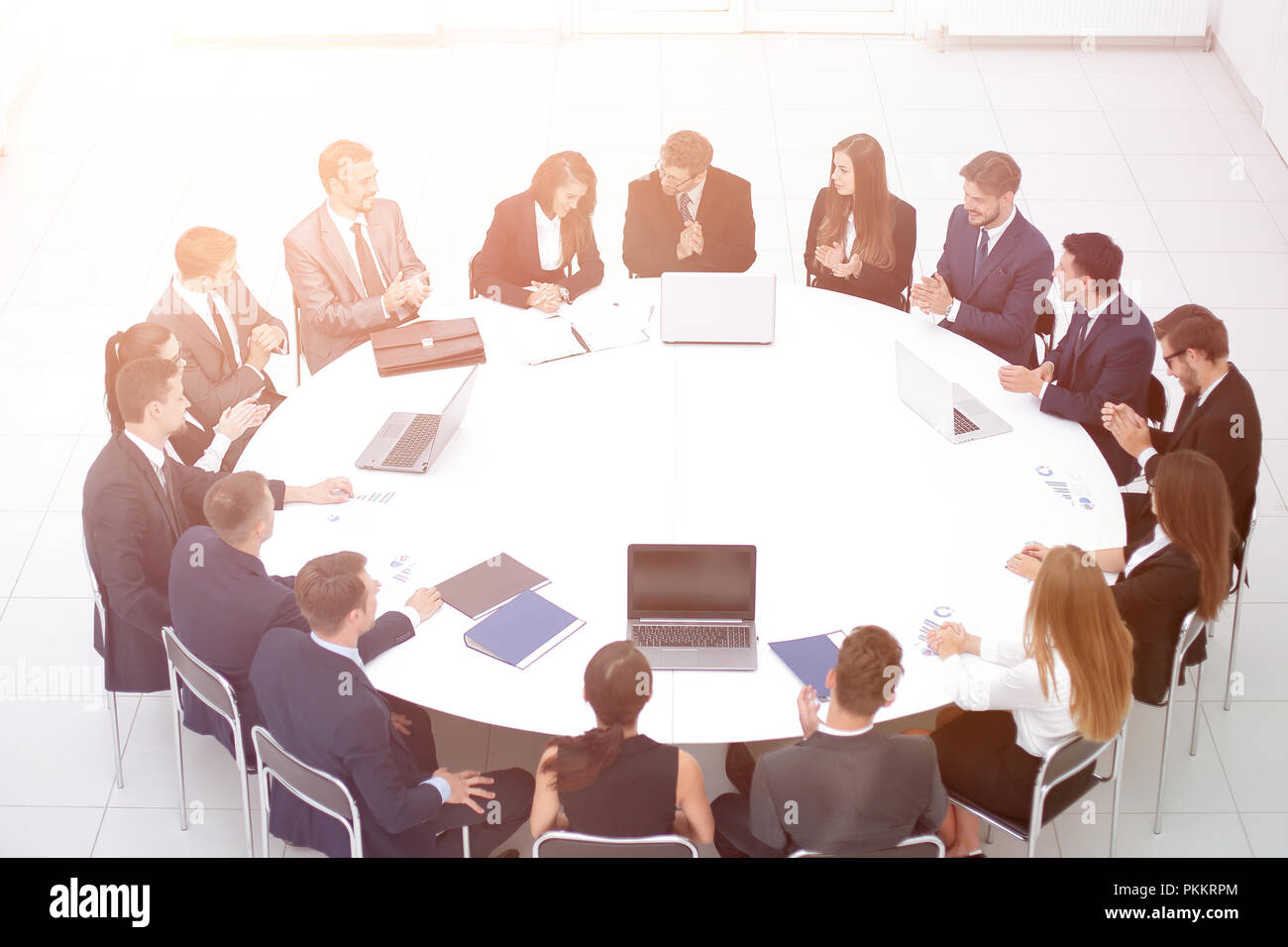 Group at table voting hi-res stock photography and images - Alamy