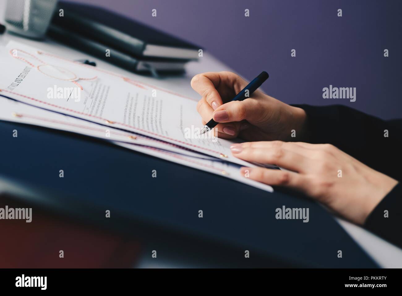 Woman signing last will and testament. Notary public office Stock Photo ...