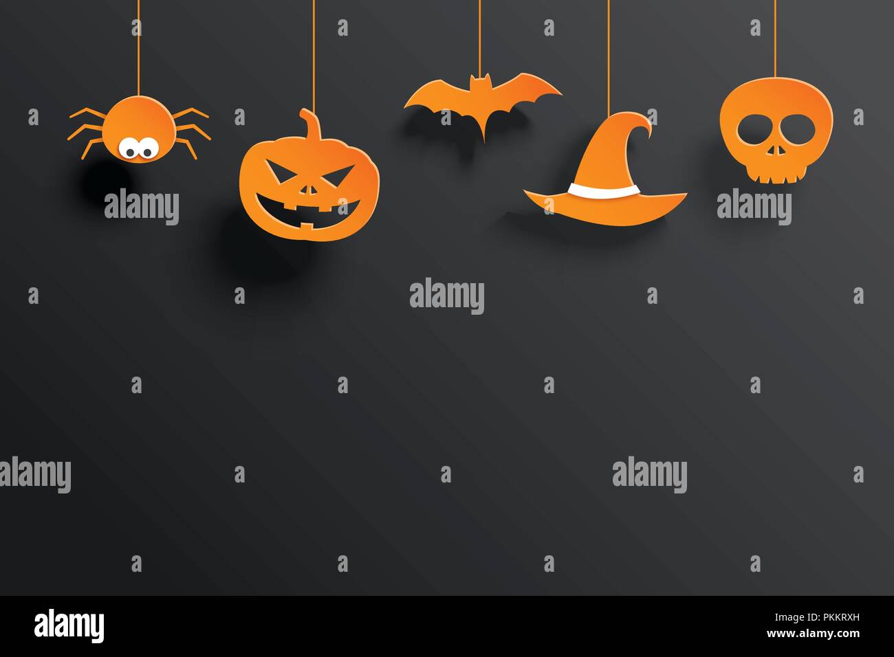 Halloween orange paper hanging in dark background. Use for greeting ...