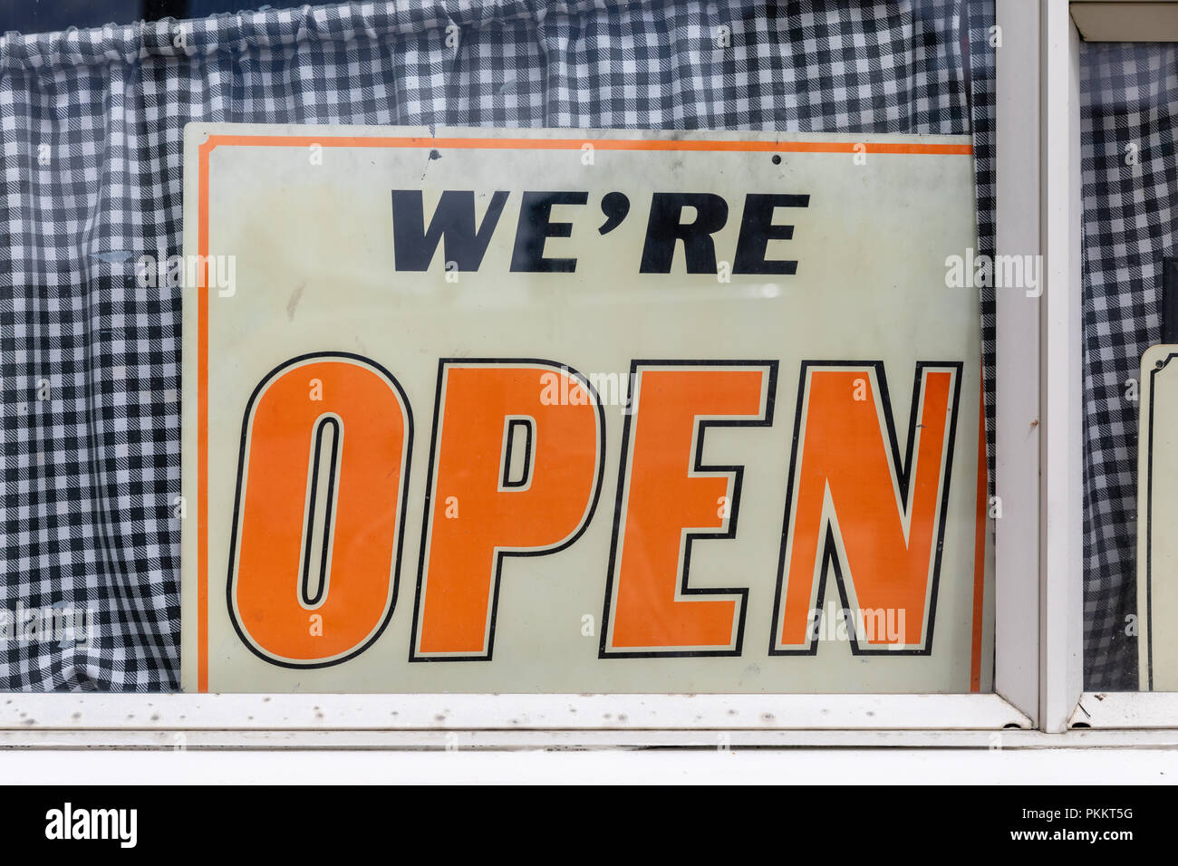 We're Open, sign in window Stock Photo - Alamy