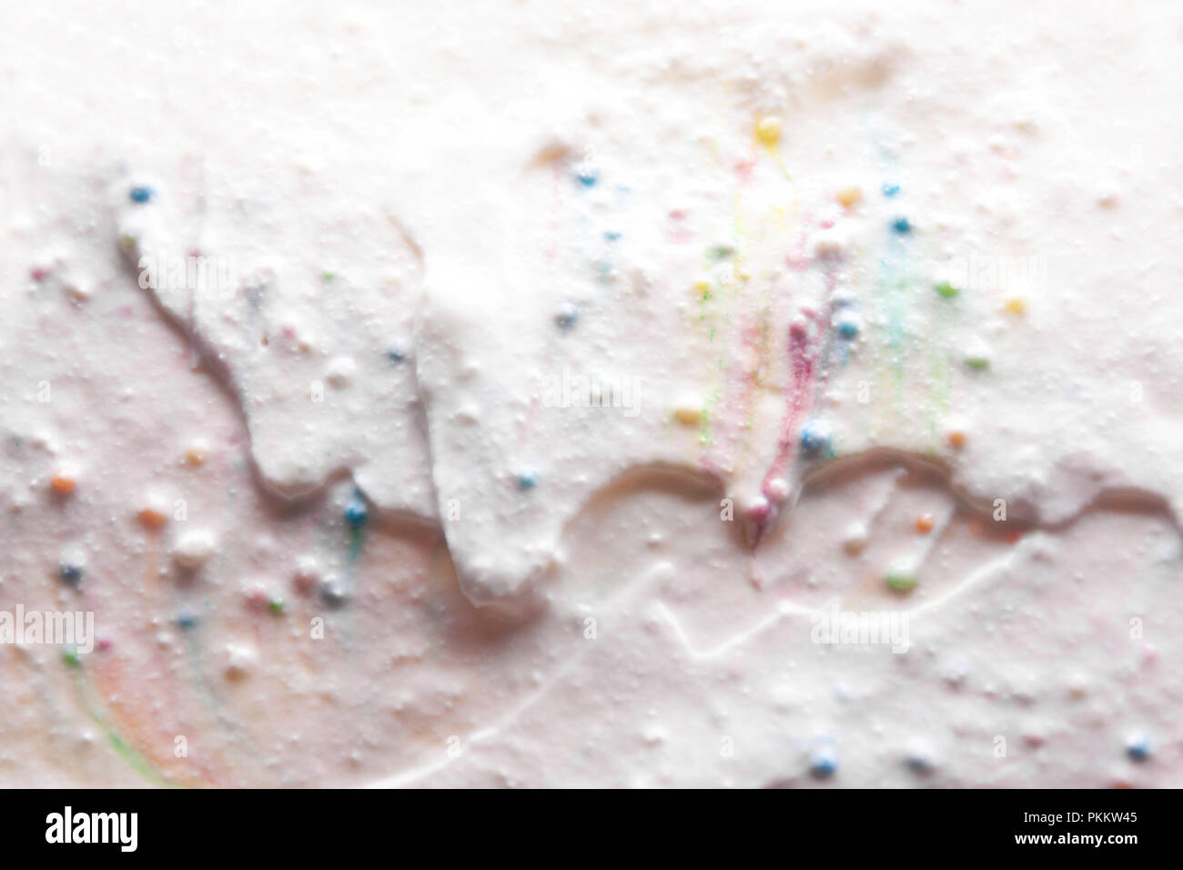 Sweet cream with colored balls, texture Stock Photo - Alamy