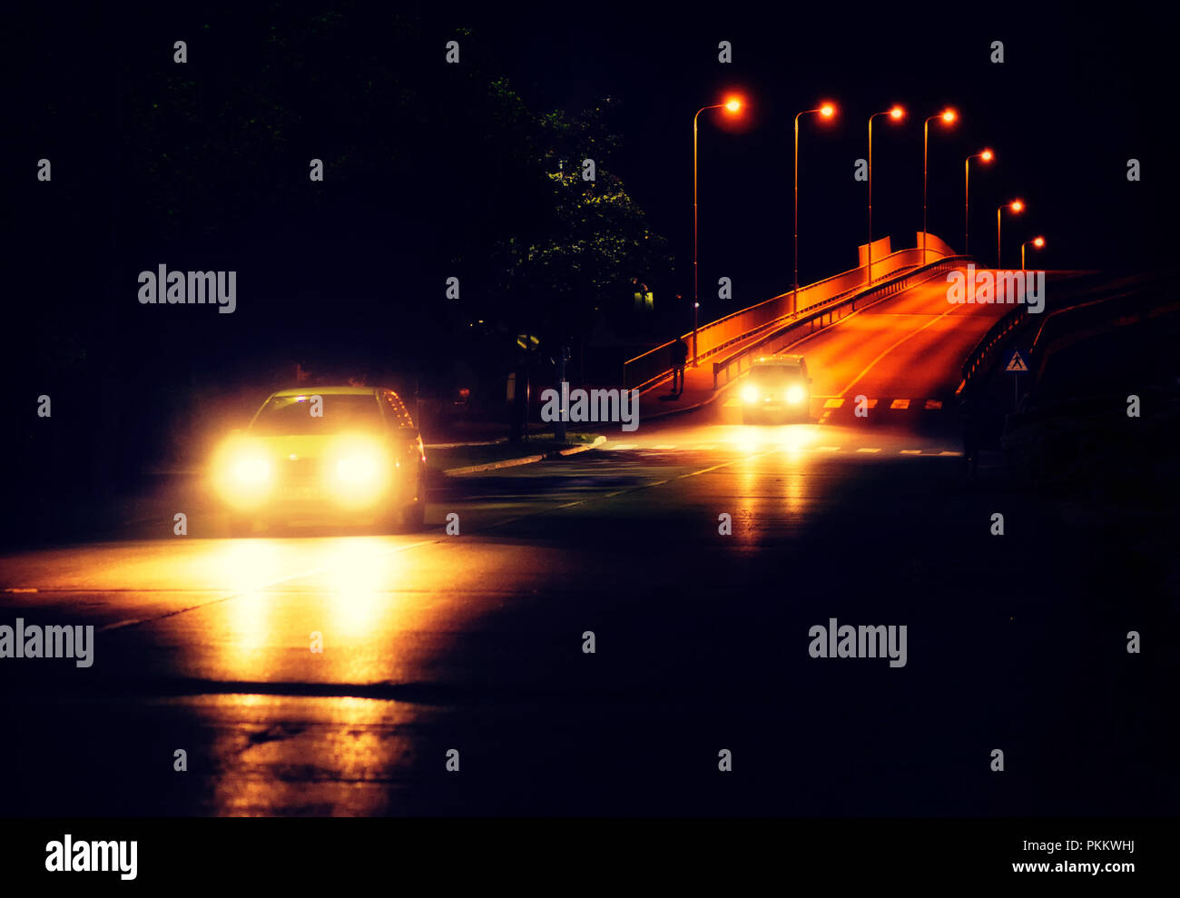Two cars, driving at night Stock Photo - Alamy