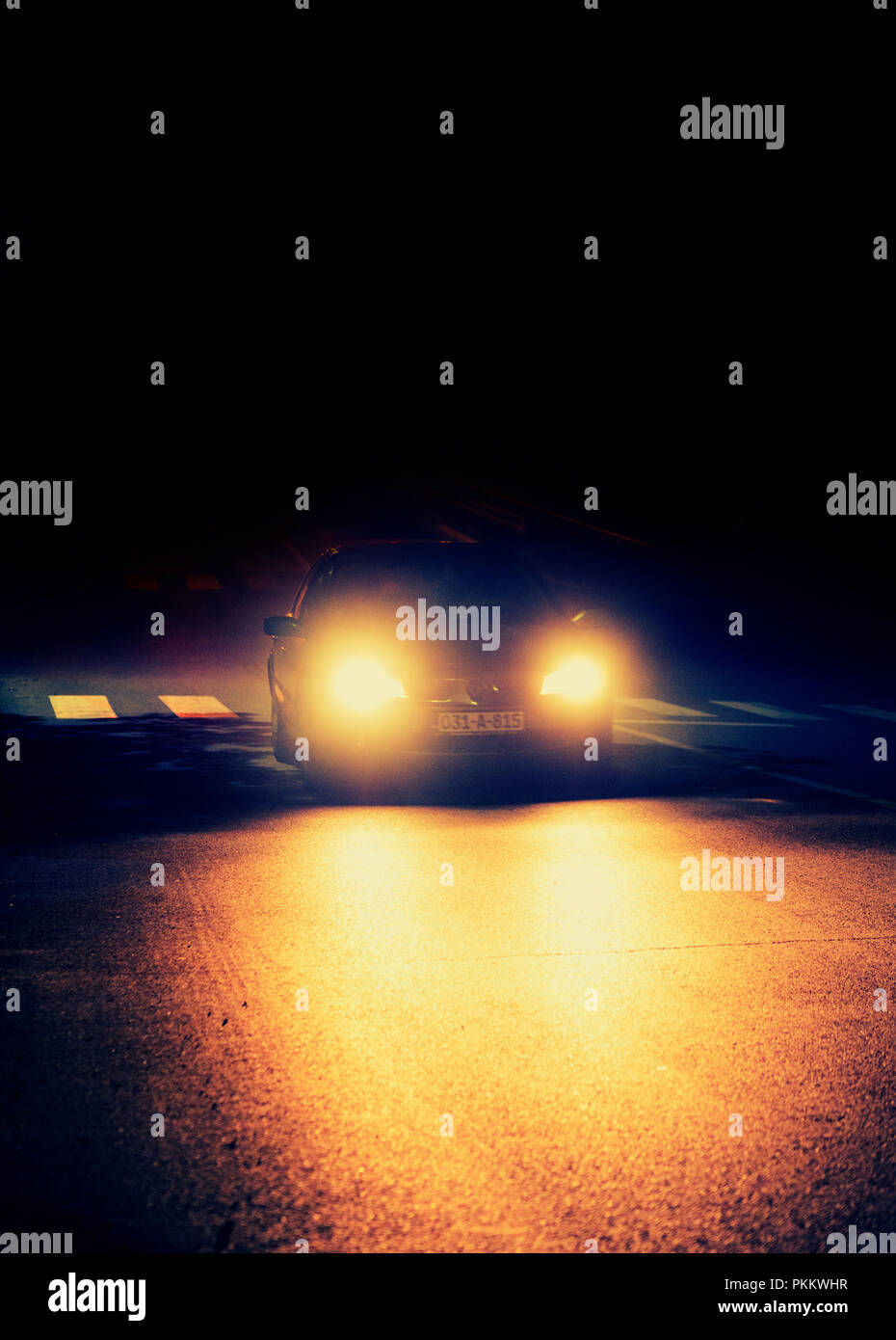 One car driving at night Stock Photo - Alamy