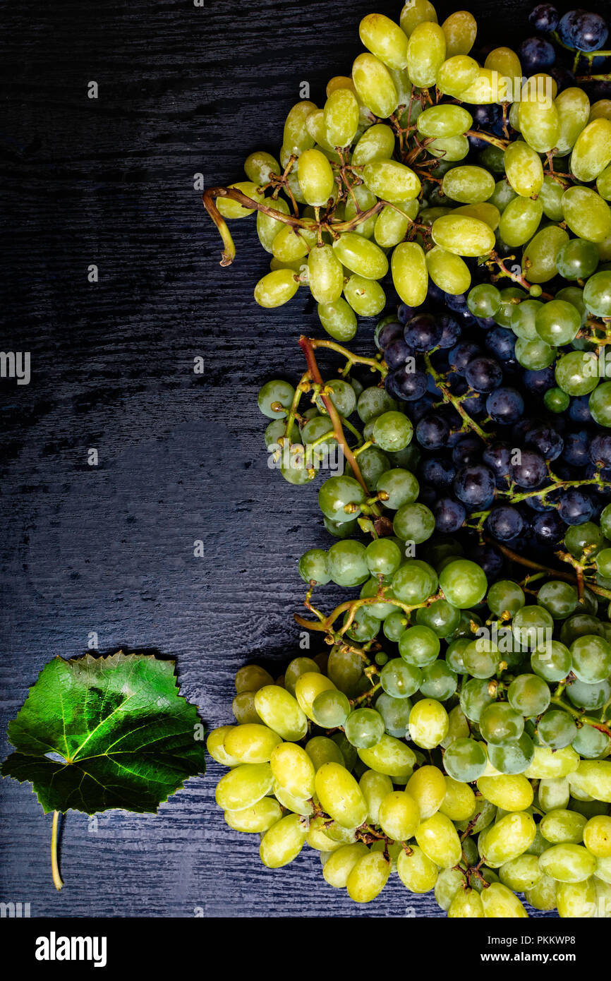 Mix of Fresh grapes on the boards, tasty food, rich of resveratrol ...