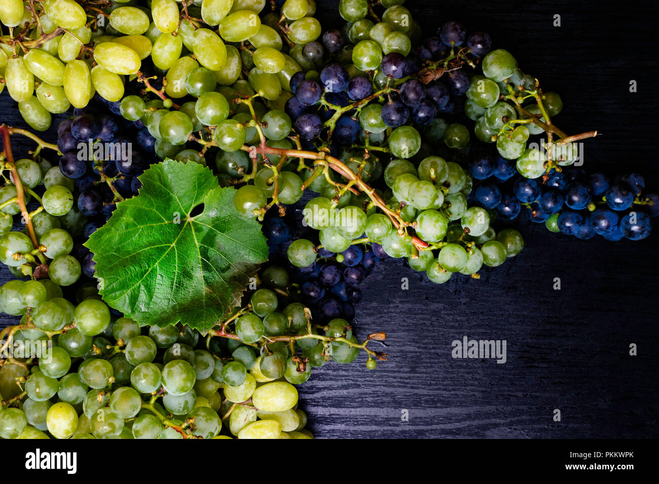 Mix of Fresh grapes on the boards, tasty food, rich of resveratrol Stock Photo - Alamy