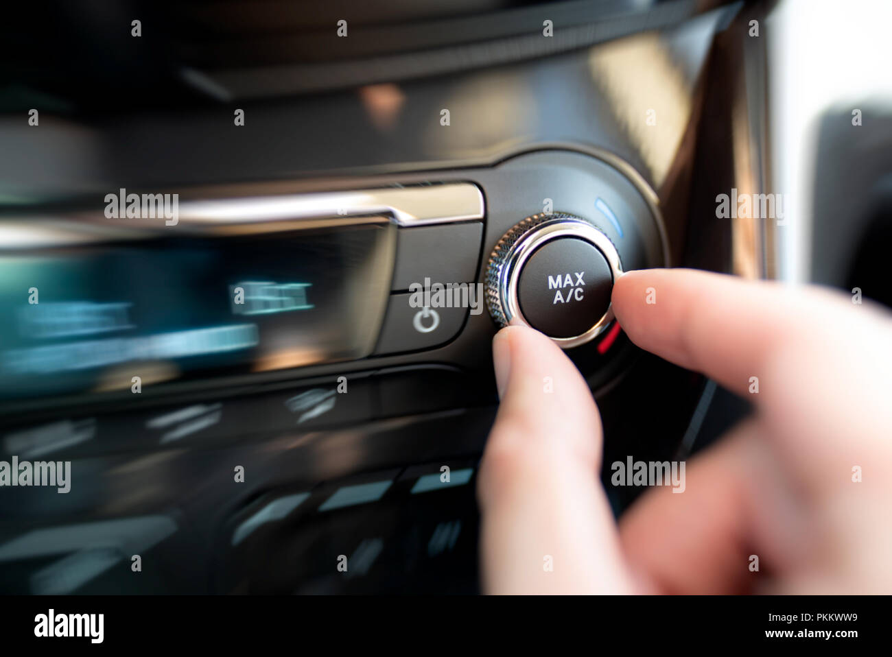 Man turning on car air conditioning system. Air conditioning button ...