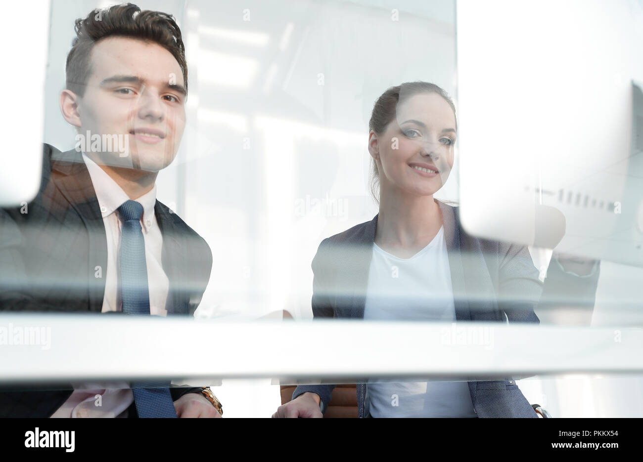 employees behind the window of a modern office Stock Photo - Alamy