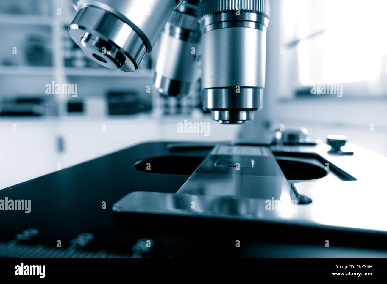 Slide and lens of microscope Stock Photo - Alamy