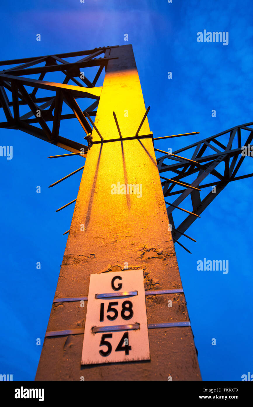 Electric train cables and pylons on Crewe station at sunset, Cheshire ...
