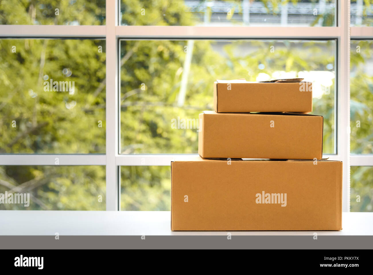 cardboard paper boxes on table, natural background, online shopping ...