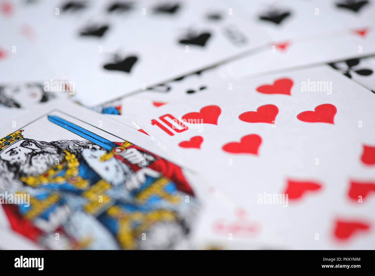 Scattered playing cards on all table hi-res stock photography and ...