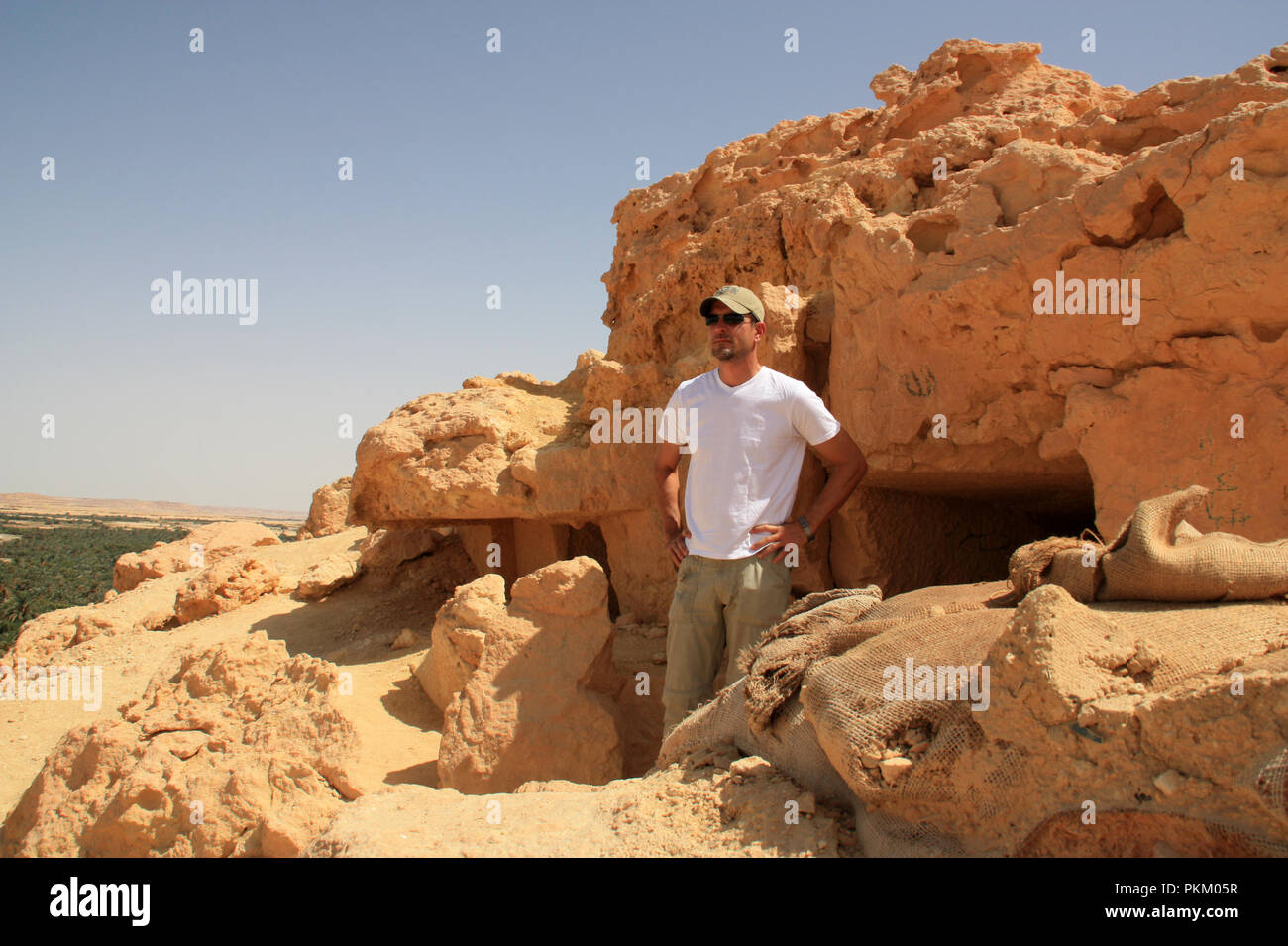 Western Tourist in front of a Tomb at the Mountain of the Dead in Siwa ...