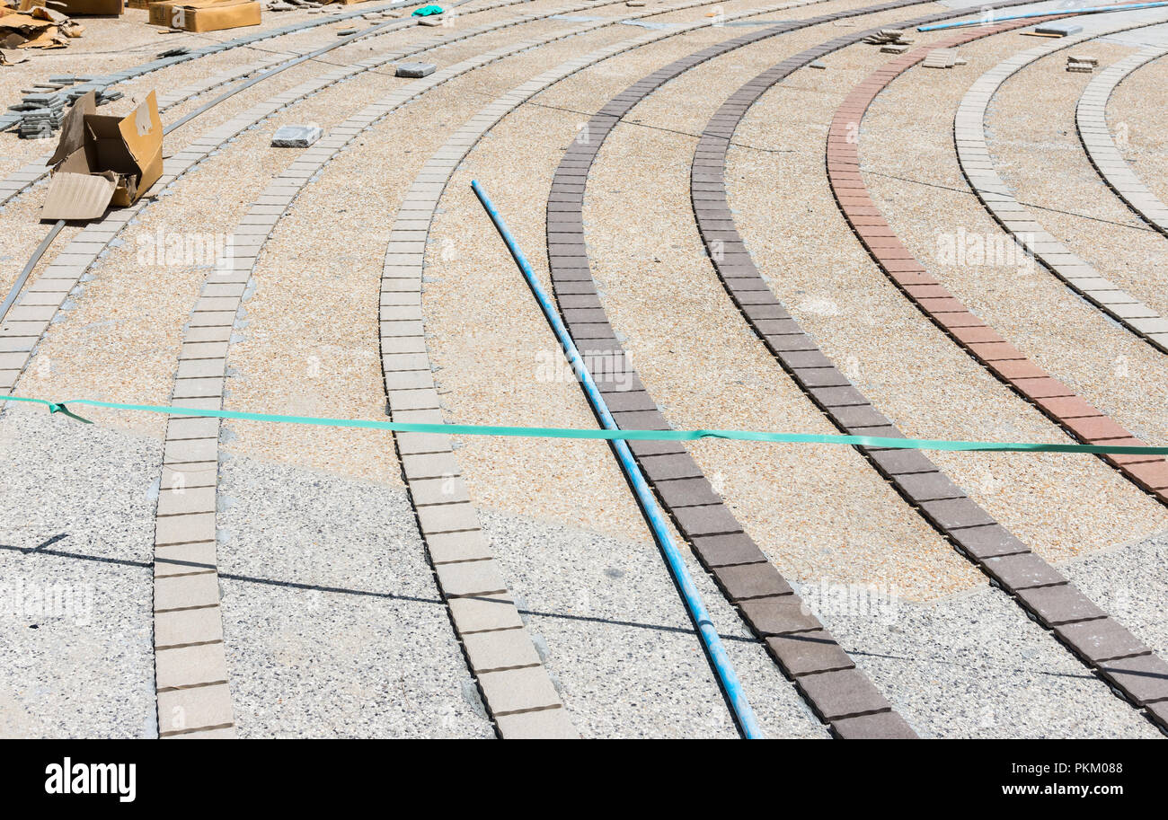 Curve brick pavement in under construction near the center square in ...