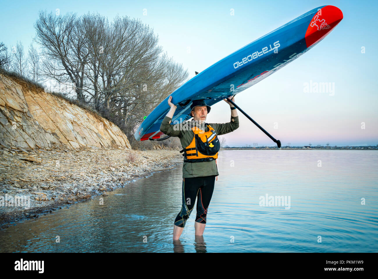 Fort Collins, CO, USA - April 22, 2018: Senior paddler is launching his ...