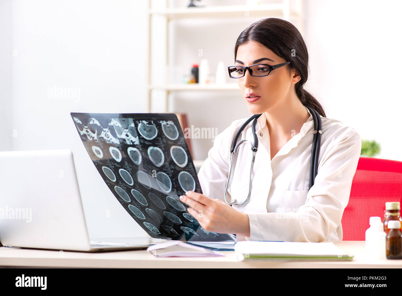 Female doctor radiologist with x-ray can image Stock Photo - Alamy