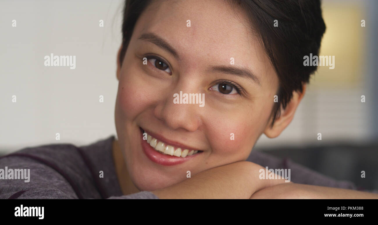 Pretty Chinese woman smiling at camera Stock Photo - Alamy