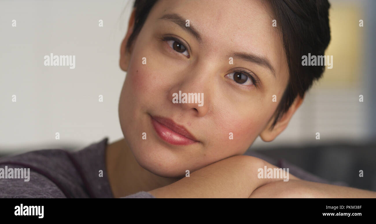 Beautiful Chinese woman looking at camera Stock Photo - Alamy