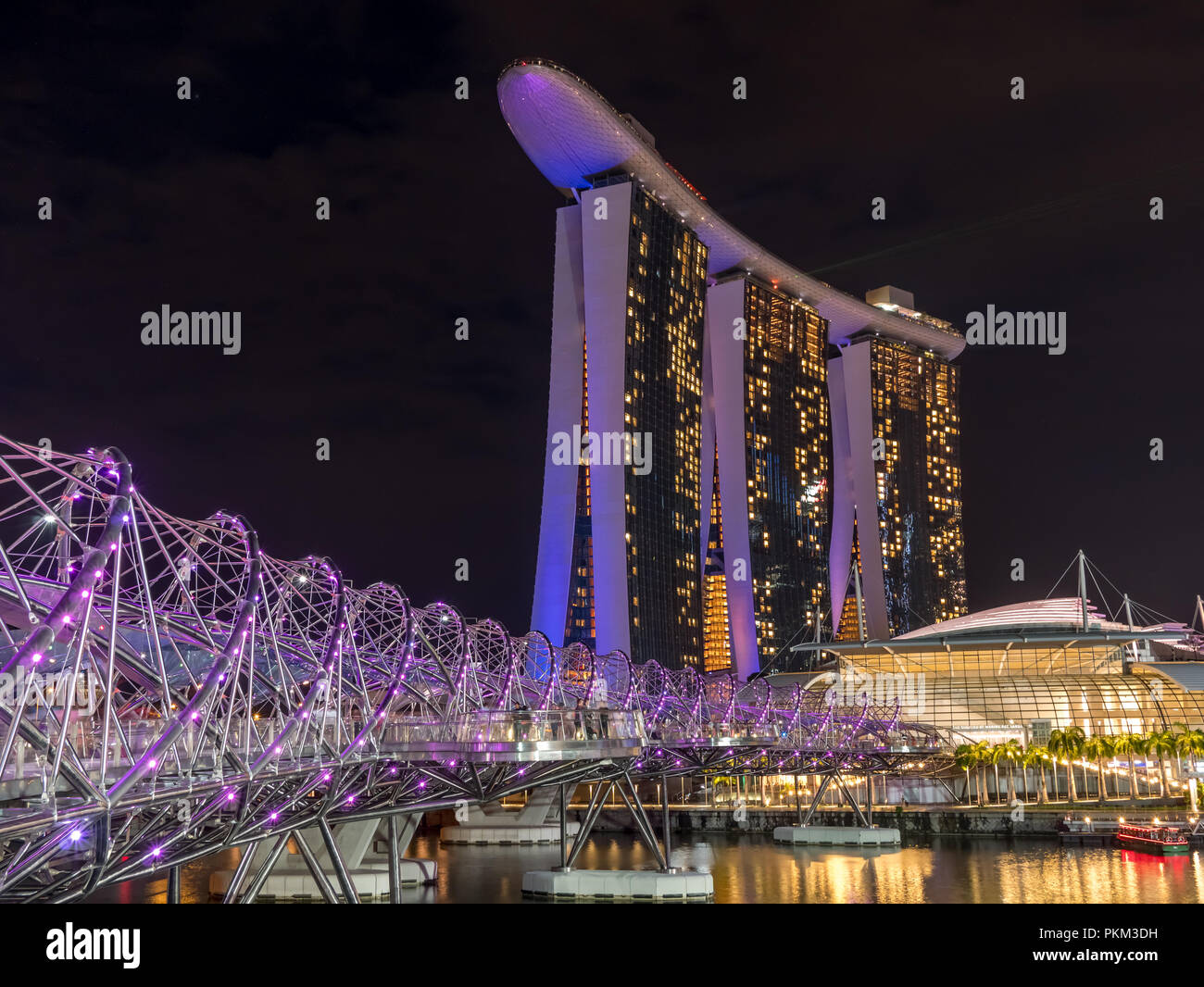 Helix Bridge and Marina Bay Sand Hotel at night time landmark in ...