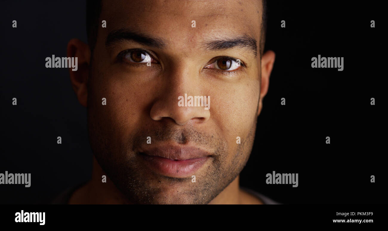 Headshot of black man looking at camera Stock Photo - Alamy