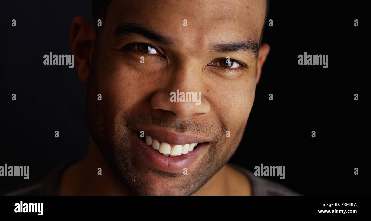 Smiling black man looking at camera Stock Photo - Alamy