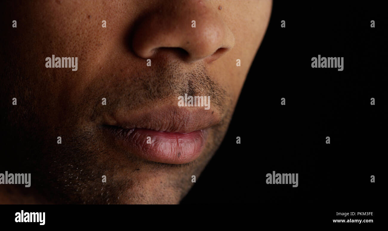 Close up on African man's lips Stock Photo - Alamy