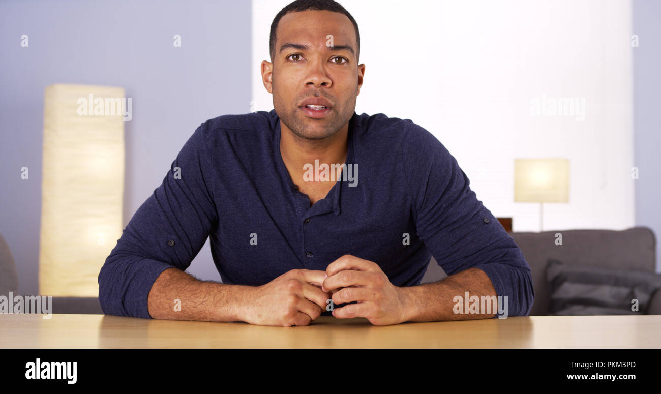Black man looking worried and concerned Stock Photo - Alamy
