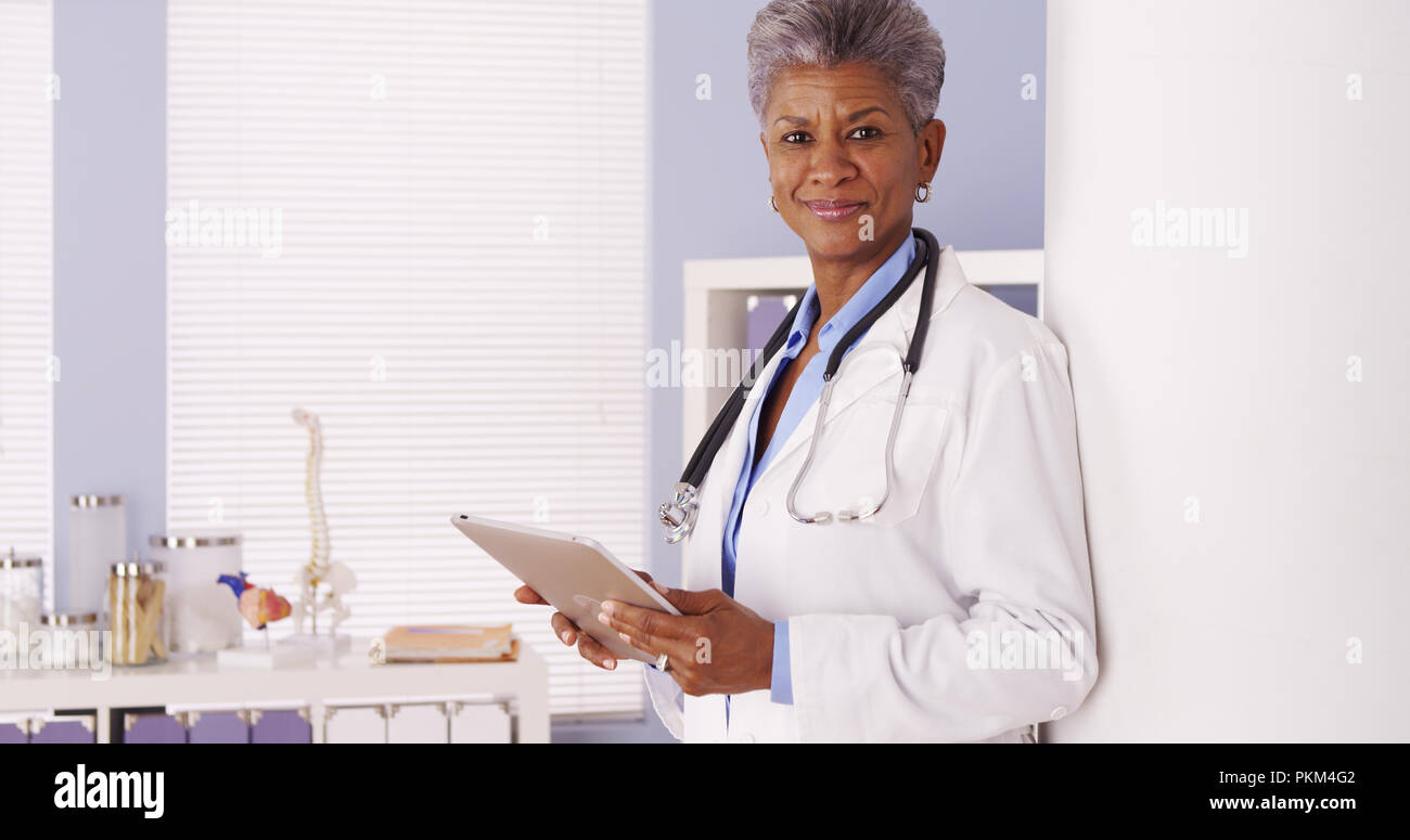 Serious old woman doctor hi-res stock photography and images - Alamy