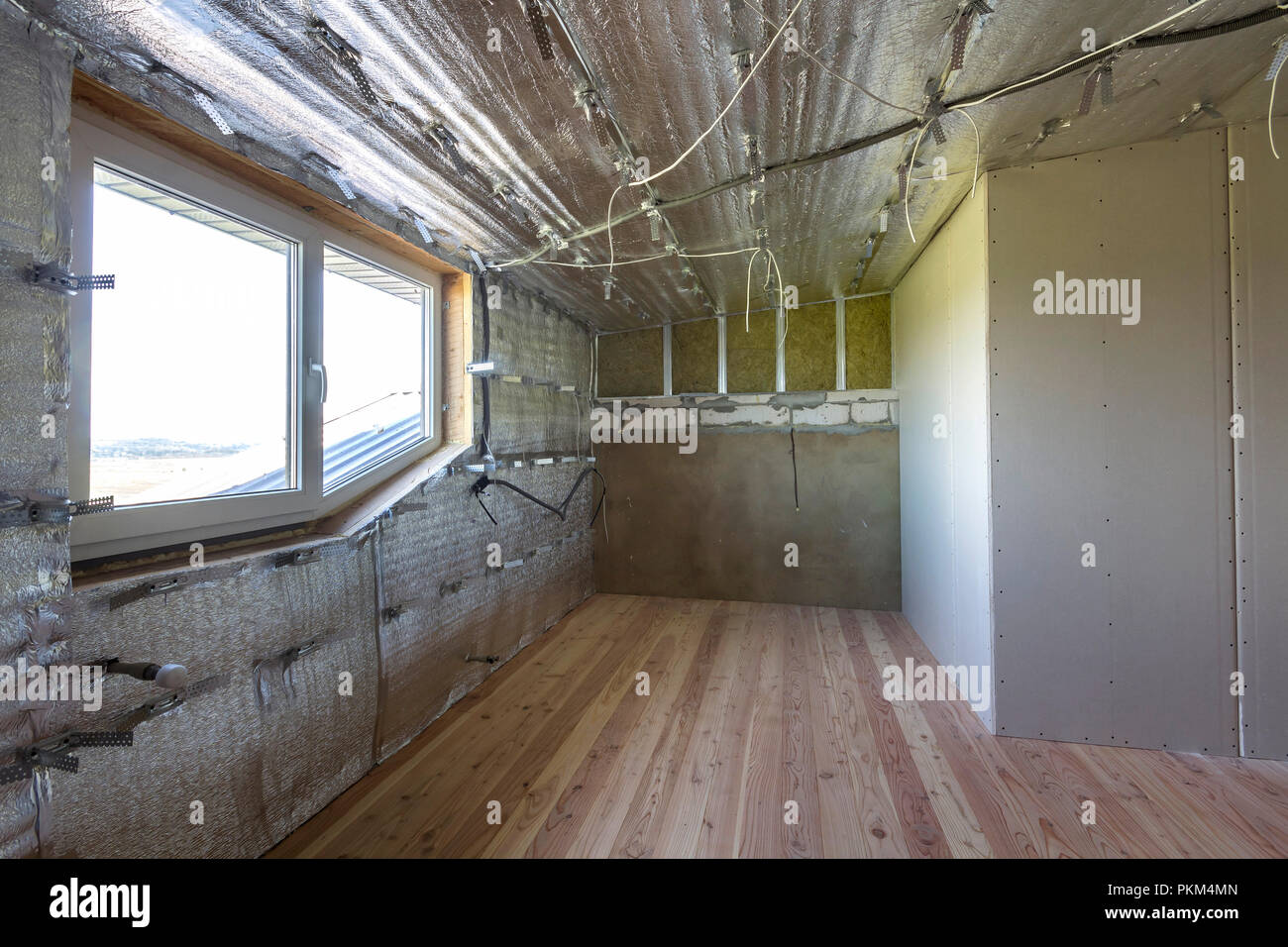 Big empty room under construction and renovation with silver aluminum ...