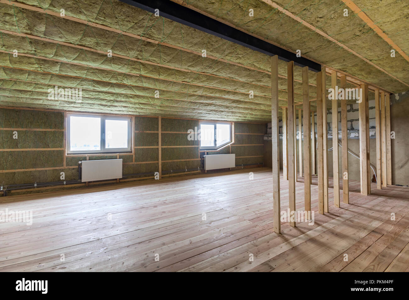Construction and renovation of big light spacious empty room with oak ...