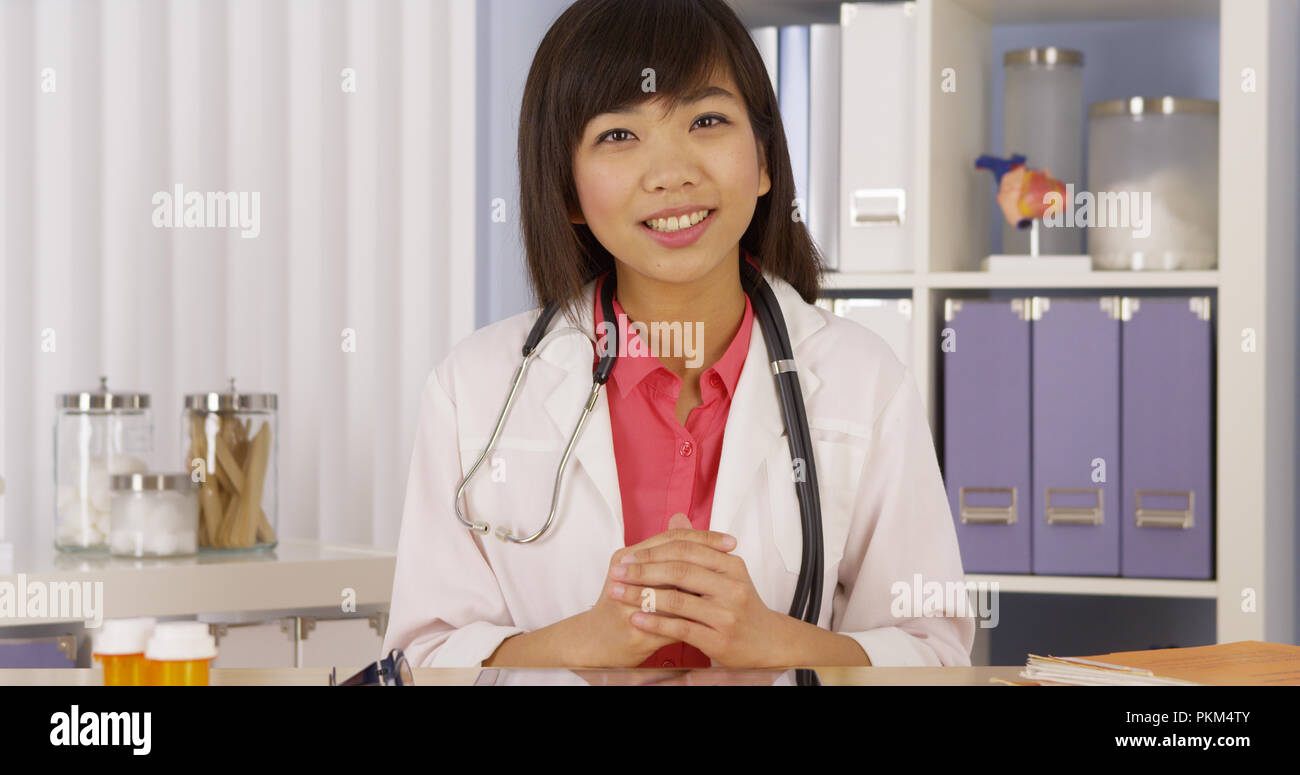 Chinese doctor talking to camera Stock Photo - Alamy