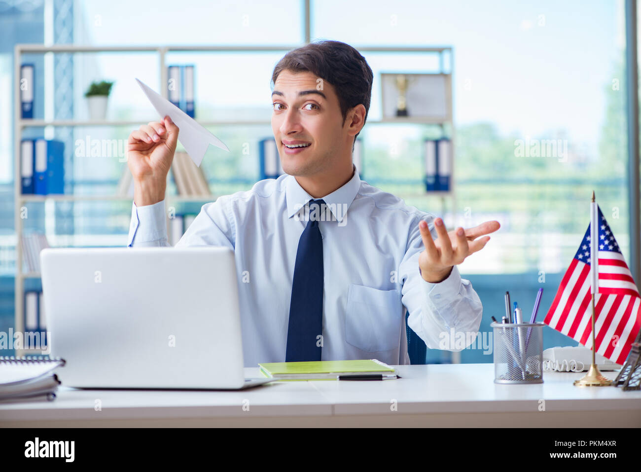 Sales agent working in travel agency Stock Photo - Alamy