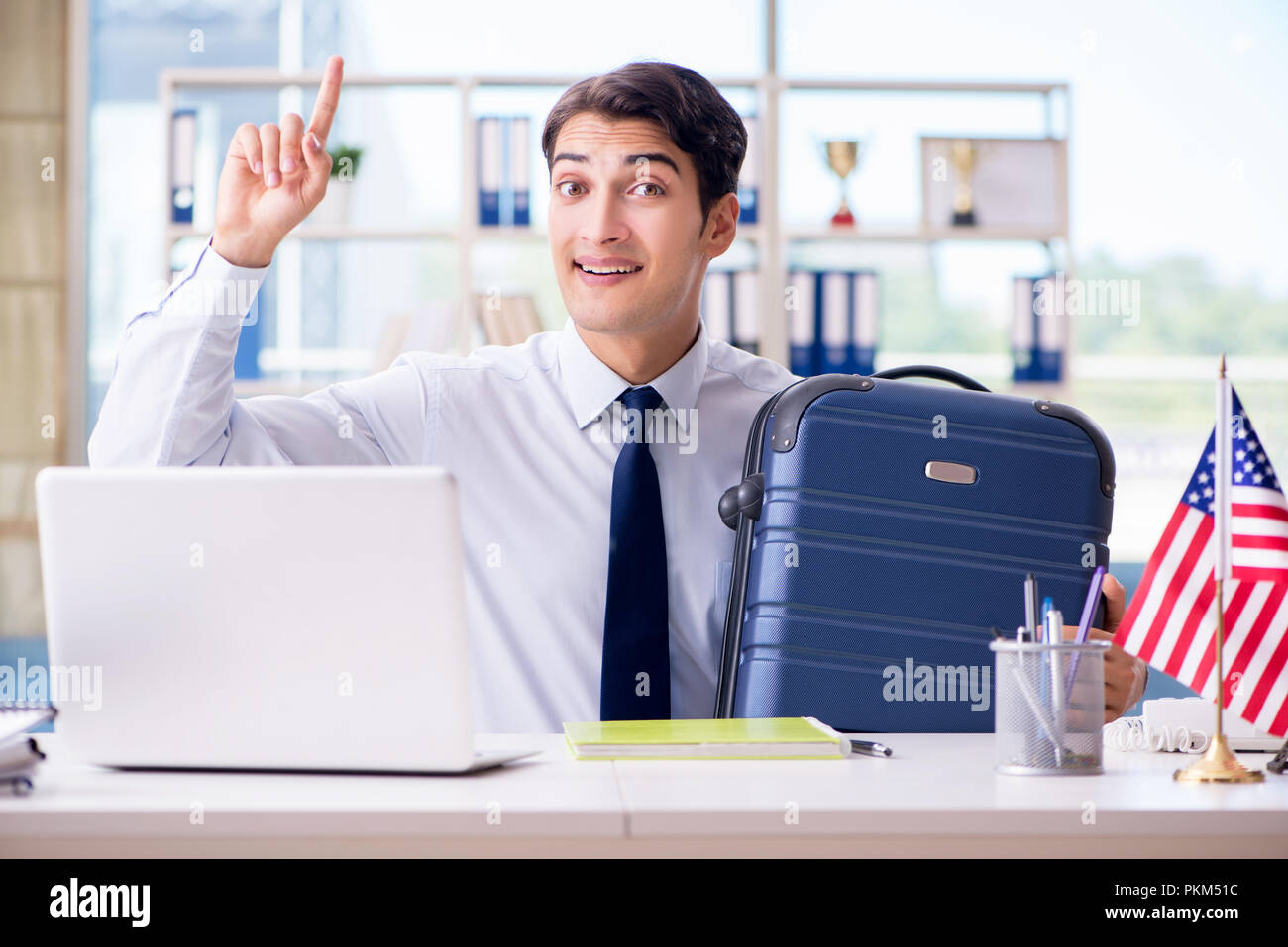 Sales agent working in travel agency Stock Photo - Alamy