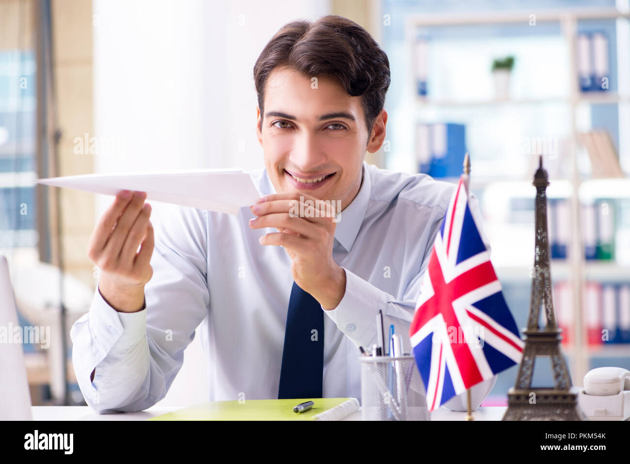 Sales agent working in travel agency Stock Photo - Alamy