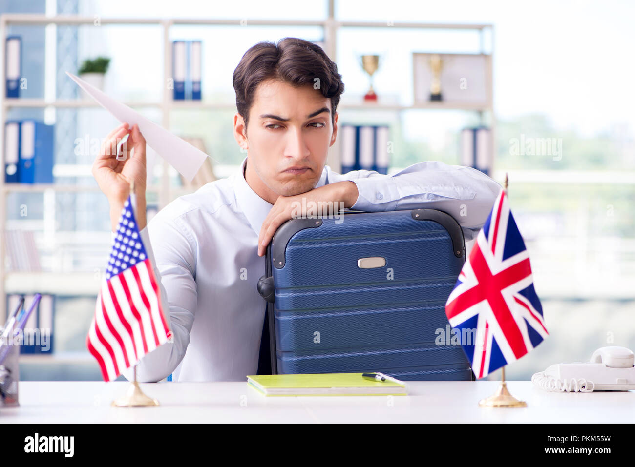 Sales agent working in travel agency Stock Photo - Alamy