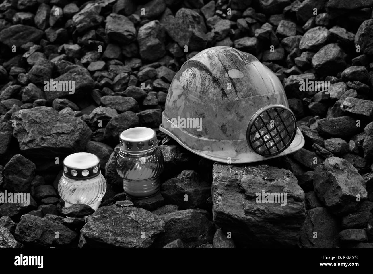 Vigil light, candle with mining helmet on cheap of coal after the fatal ...