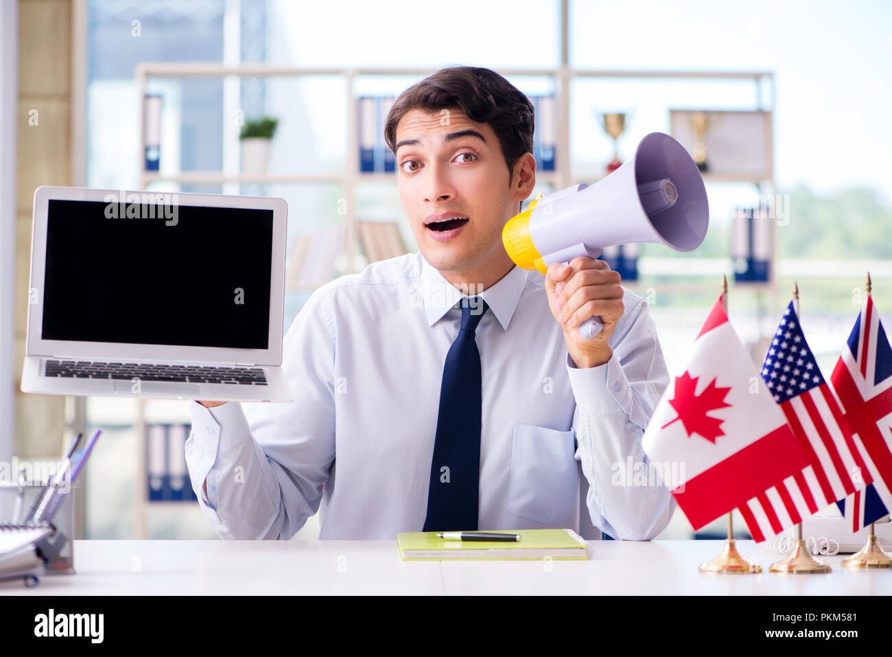 Sales agent working in travel agency Stock Photo - Alamy
