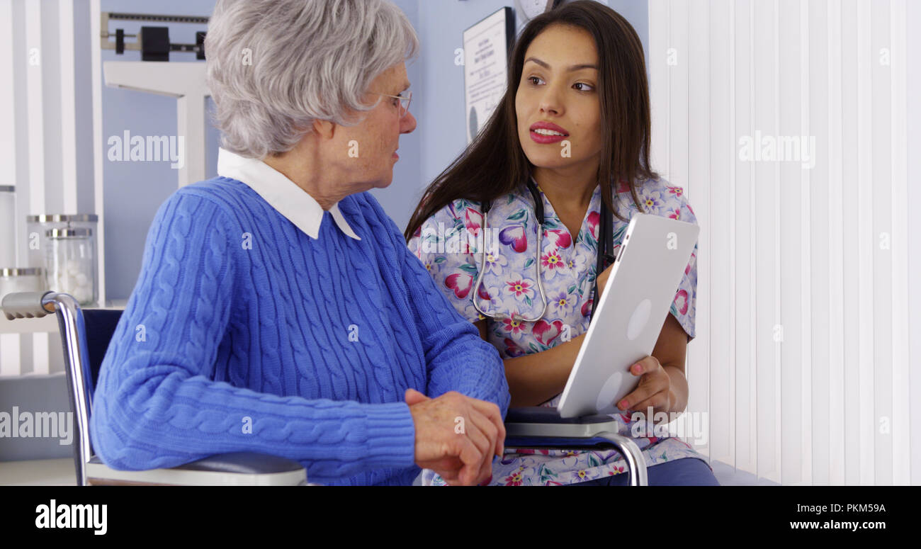 Elderly hispanic woman with caregiver hi-res stock photography and ...