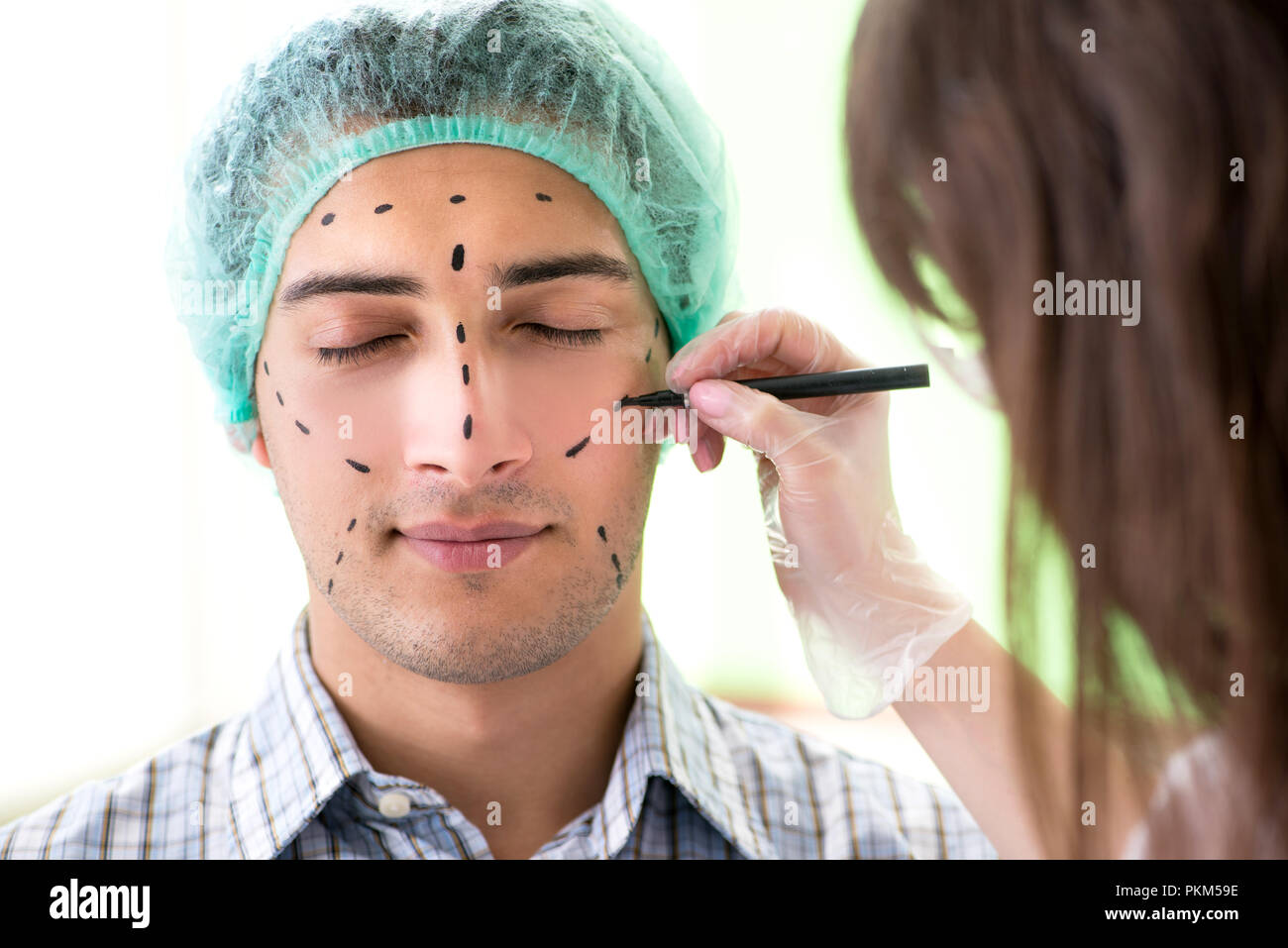 Plastic surgeon preparing for operation on man face Stock Photo - Alamy
