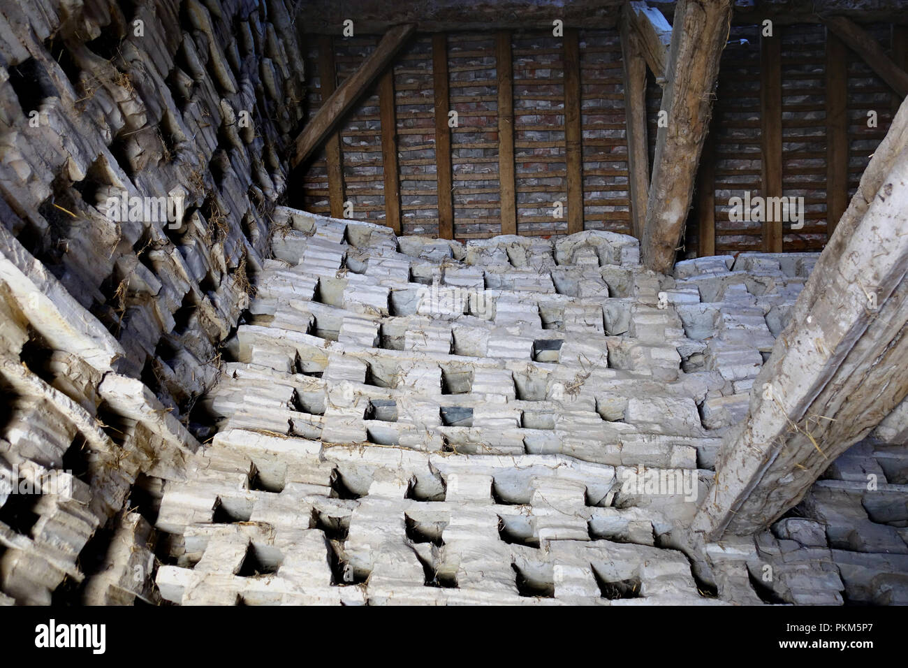 The inside of a very old dovecote, showing the ancient wooden beams and ...
