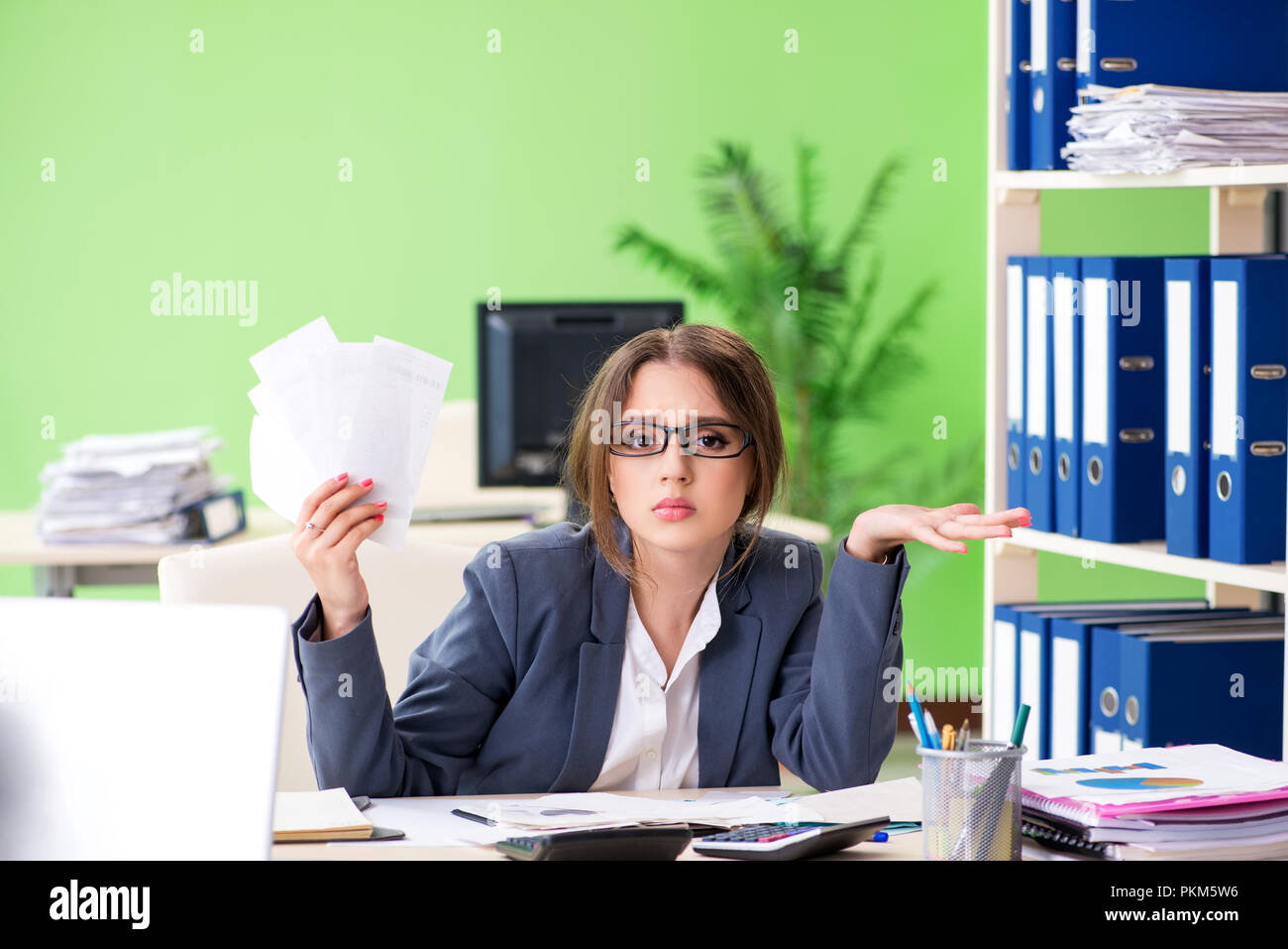 Female financial manager working in the office Stock Photo - Alamy