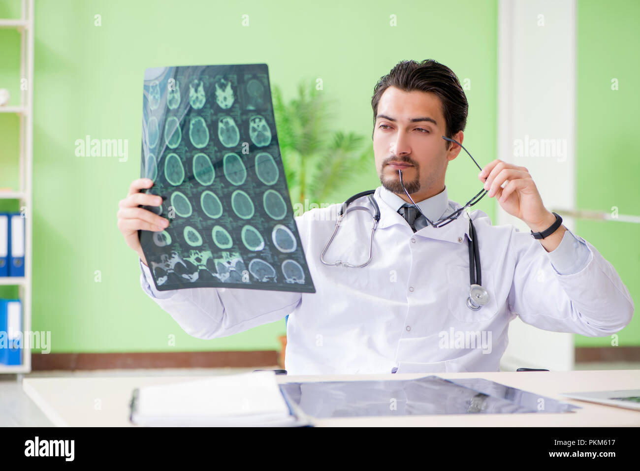 Doctor radiologist looking at x-ray scan in hospital Stock Photo - Alamy