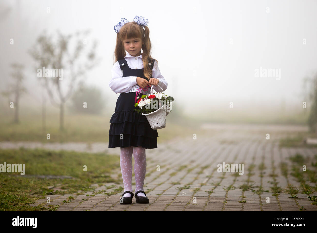 Full-length portrait of cute adorable first grader girl in school ...