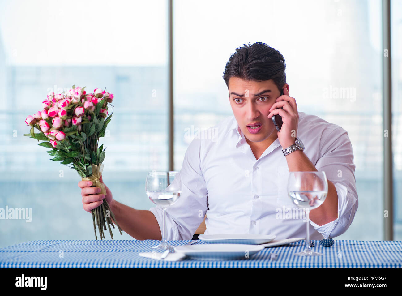 Angry man sitting alone at dinner table hi-res stock photography and ...