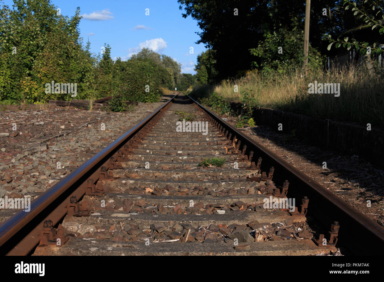 single train track on lost places trainstation Stock Photo - Alamy