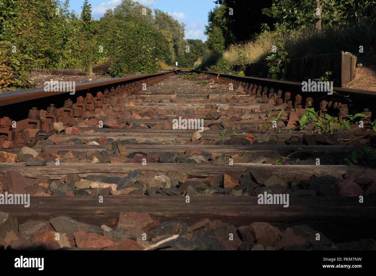 single train track on lost places trainstation Stock Photo - Alamy