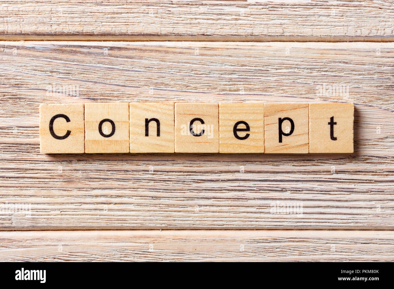 Concept word written on wood block. Concept text on table, concept ...