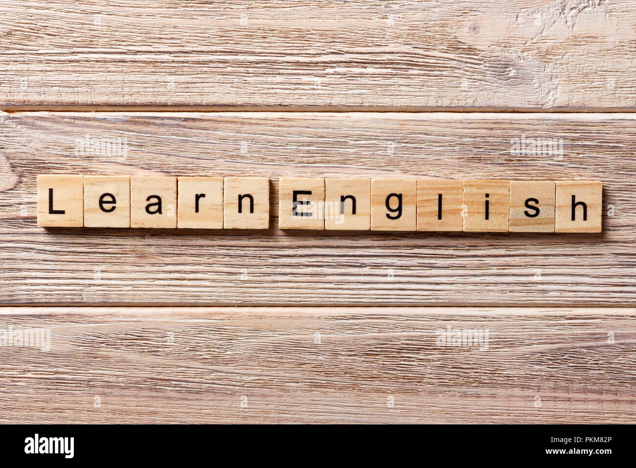 learn english word written on wood block. learn english text on table ...