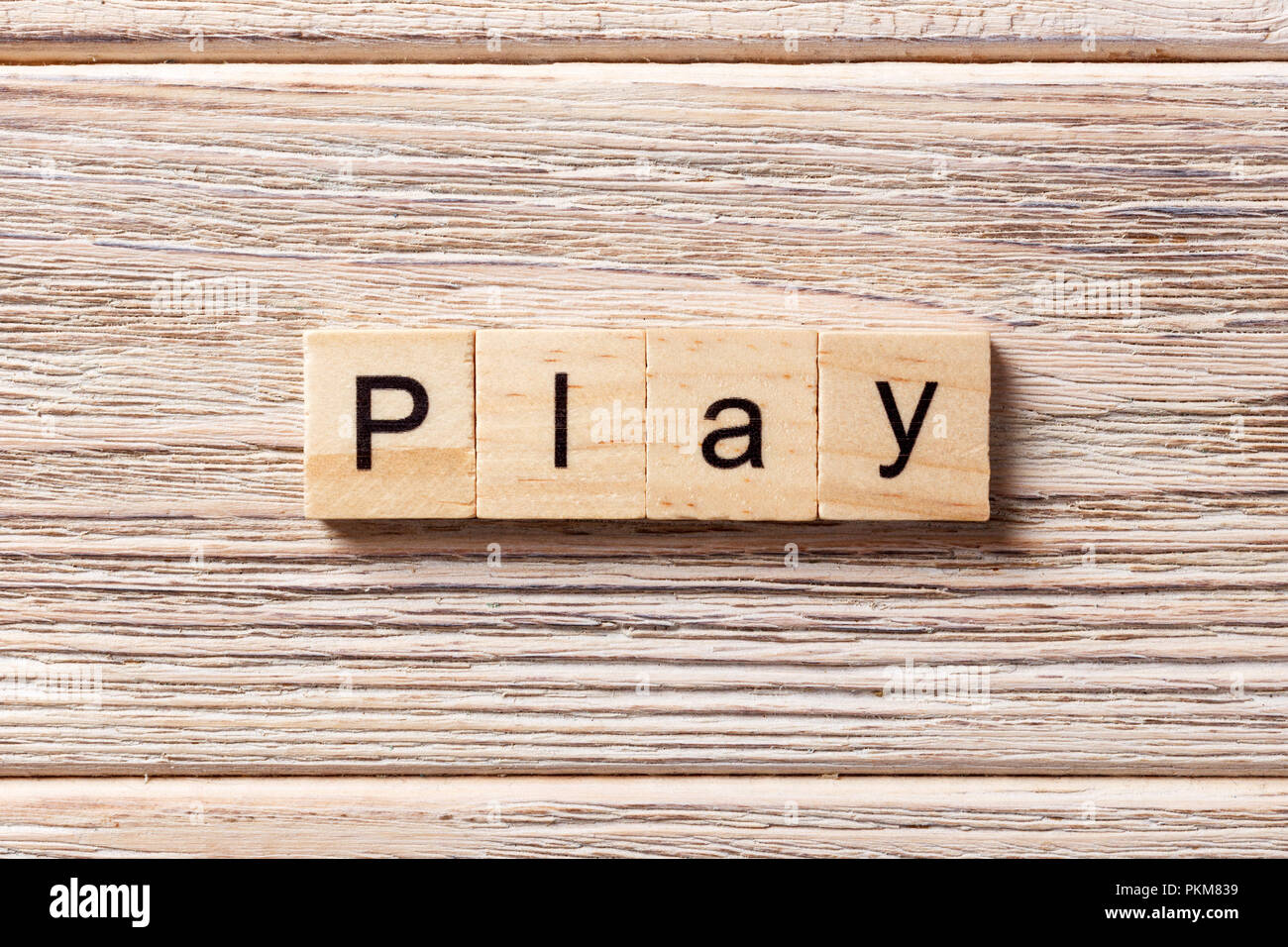play word written on wood block. play text on table, concept Stock ...